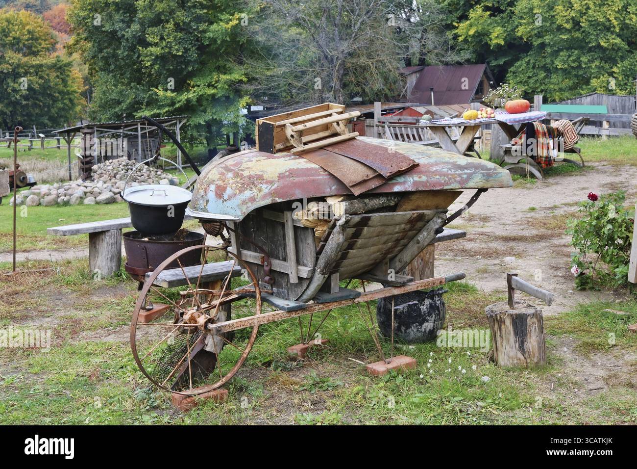 The self-made container for firewood is made from an old wooden cart ...