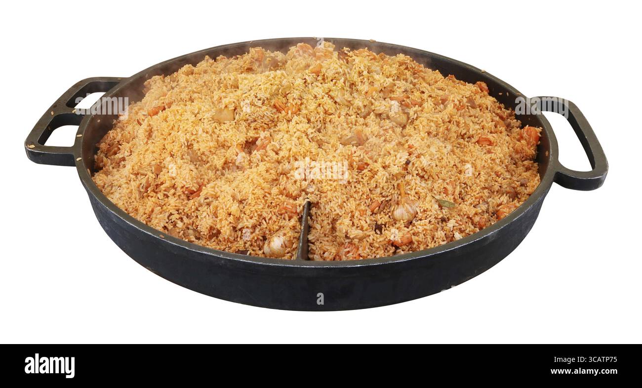 Fast food of the big city - metal big frying pan with hot Asian pilaf ...