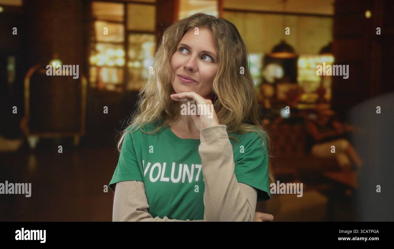 Woman gestures with hand while thinking in a cafe as a blonde young ...