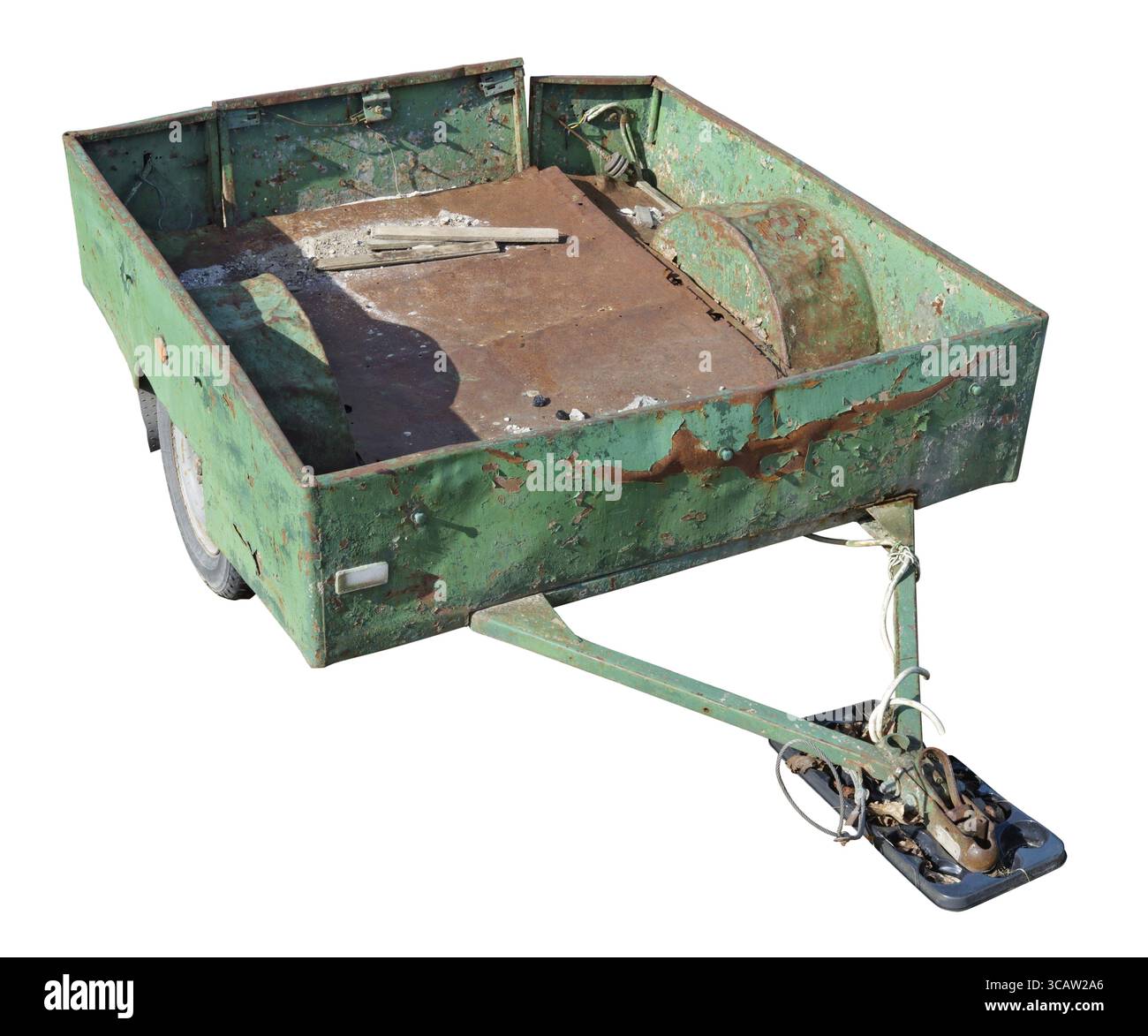 Old rusty cargo trailer for a car in a landfill garbage. Isolated on ...