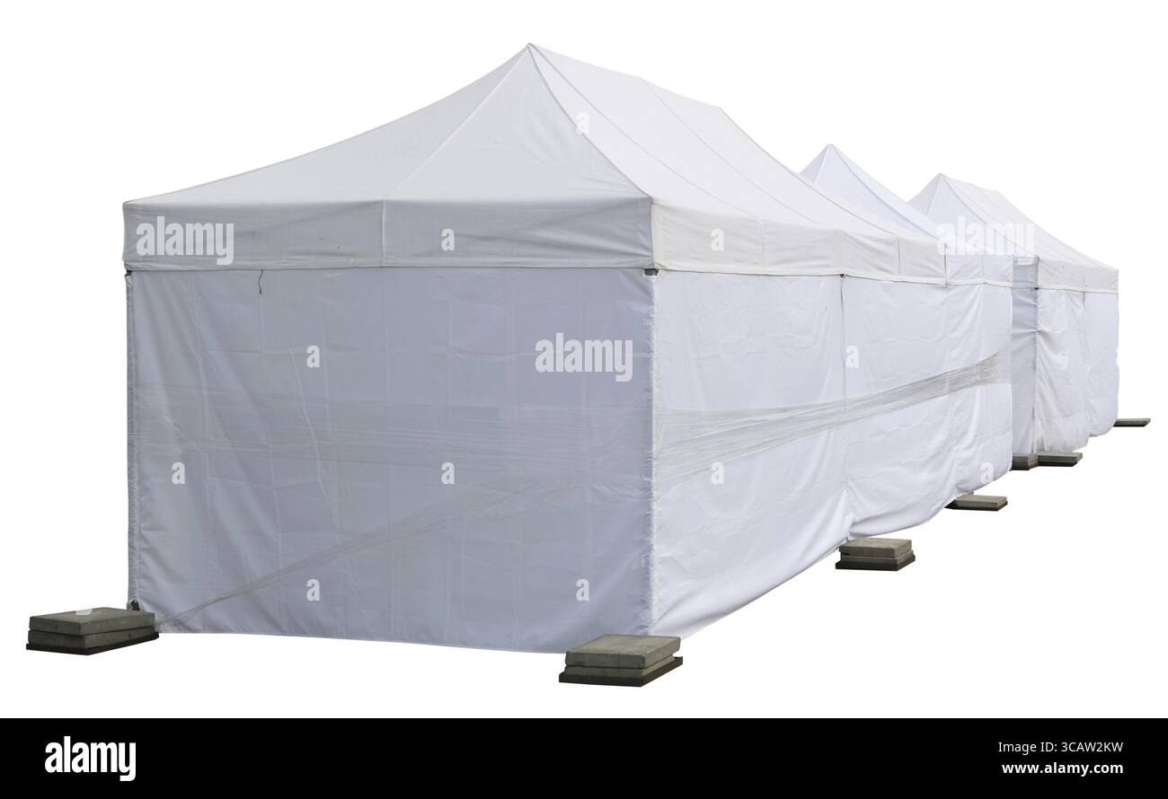 White canvas no name tents is installed on the street. The corners of ...