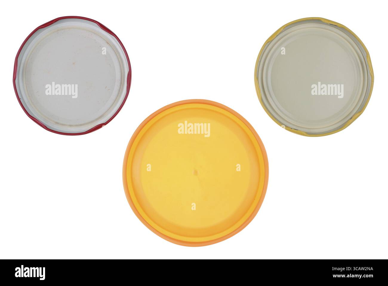 The reverse side of used tin and plastic covers from glass jars with ...