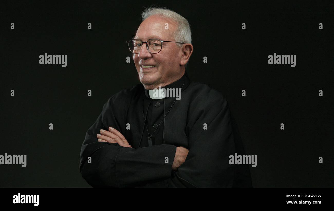 Senior priest glasses smiling crossing hi-res stock photography and ...