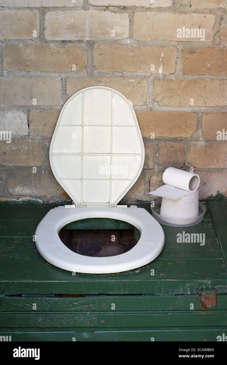 Simple village rural plastic toilet bowl in a brick shed Stock Photo ...