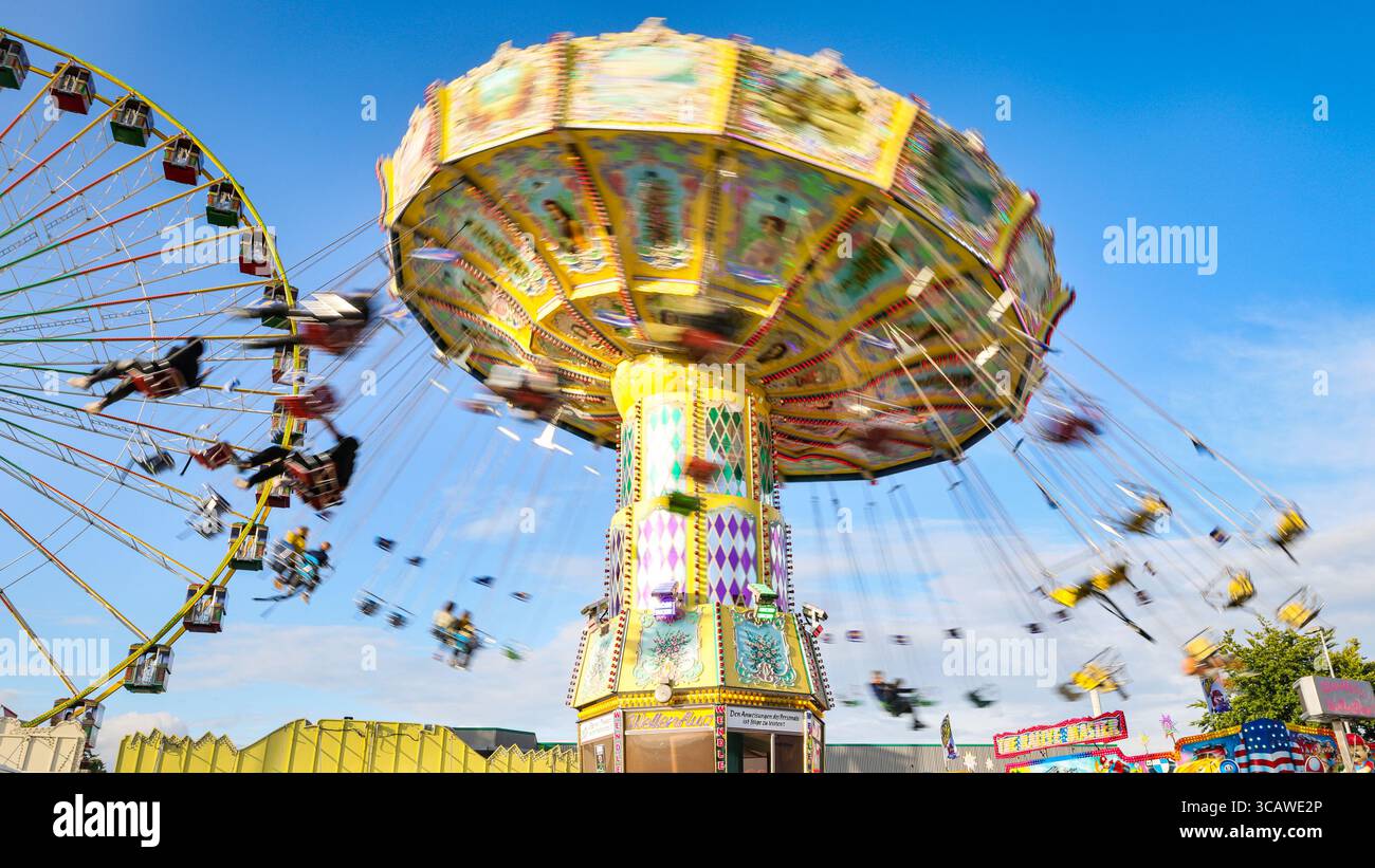 Cranger Kirmes, old-fashioned merry-go-round carousel, funfair rides ...