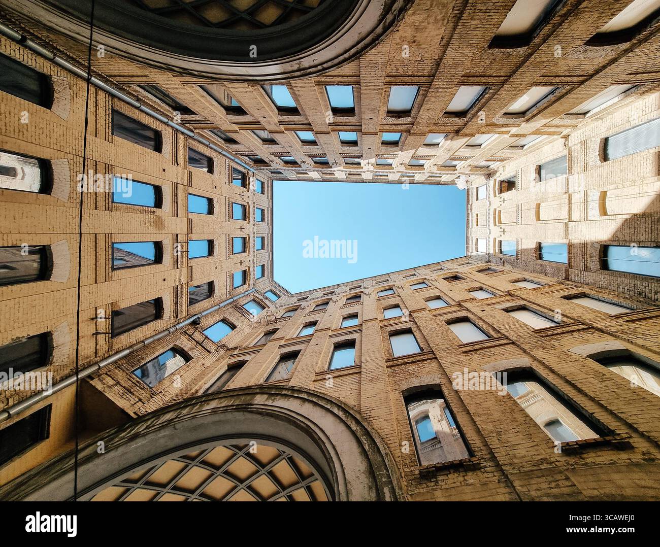 19th century courtyard - low-angle shot. Looking up at the sky. Light ...