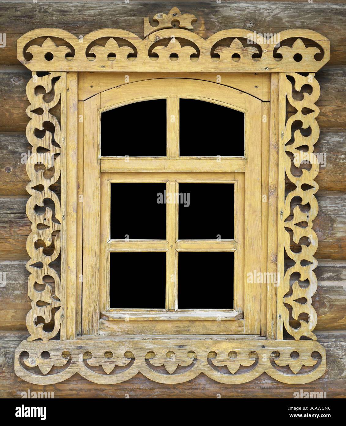 Handmade carved wooden window frame in a log village shed. Glass ...