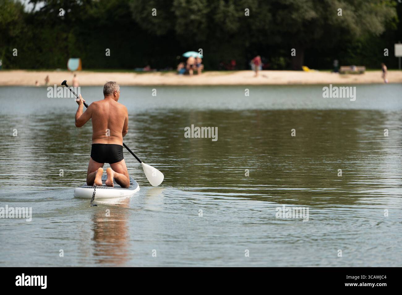 Water rides on sup board hi-res stock photography and images - Alamy
