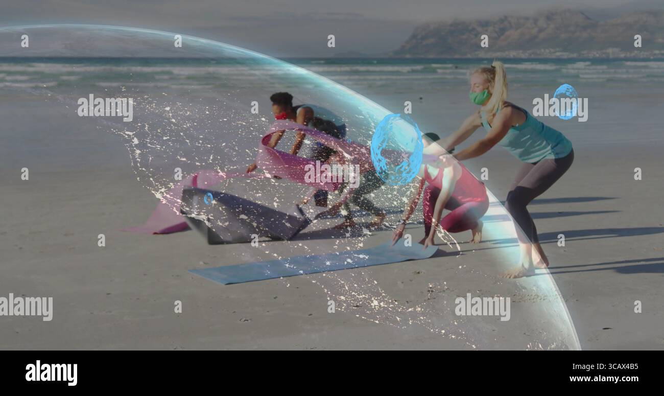 Women wearing activewear performing lunges in sandy shoreline with ...