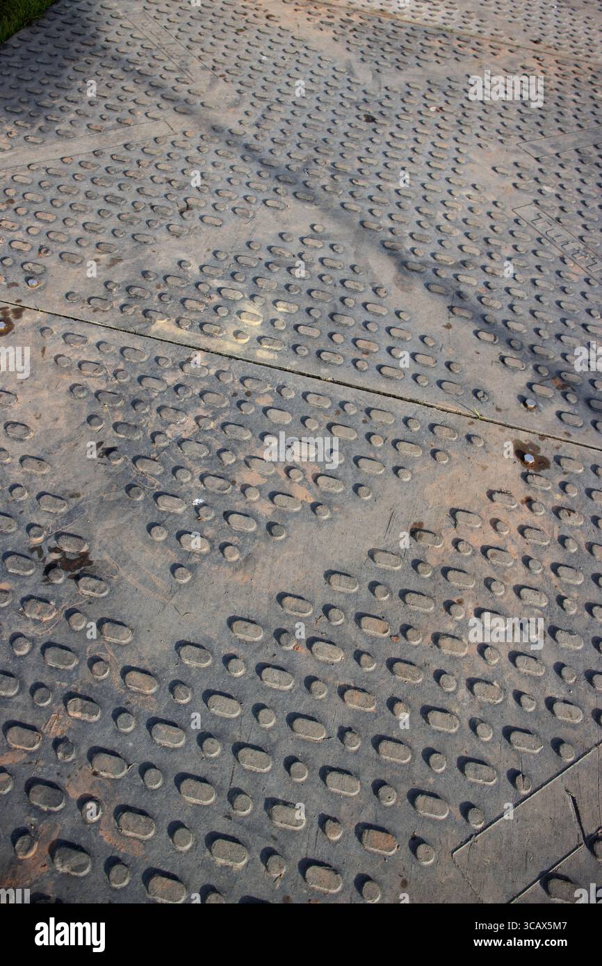 metal sheeting mat laid on grass to give heavy machines traction Stock ...