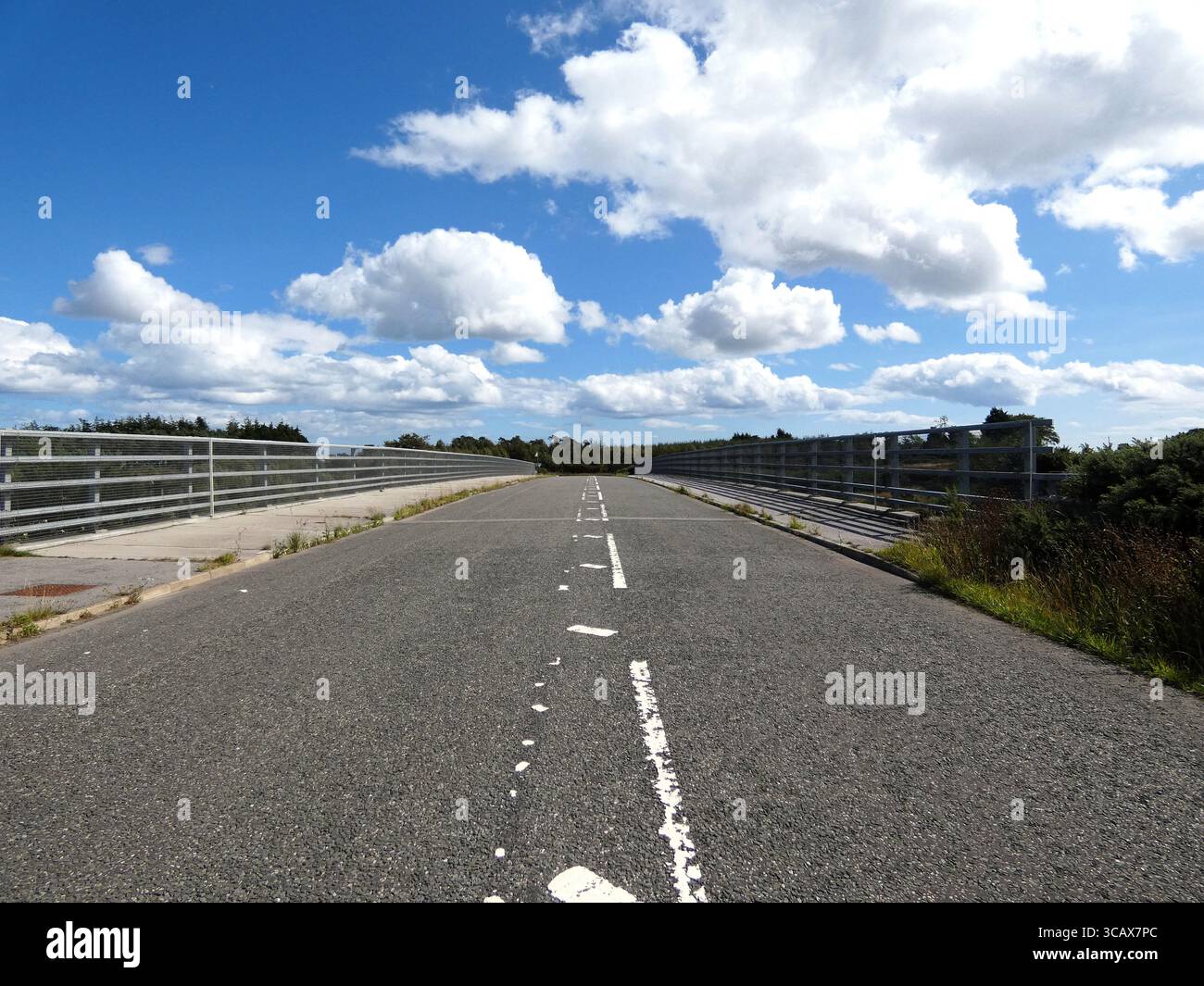 Deserted asphalt road stretches hi-res stock photography and images - Alamy