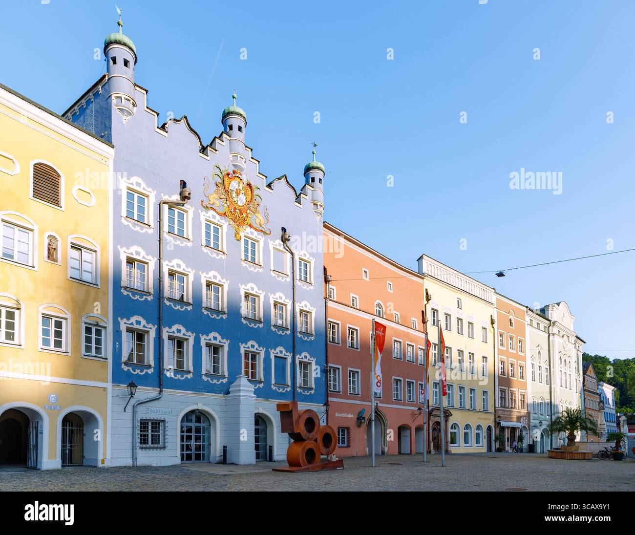 Town square with historic town hall and monument commemorating the ...