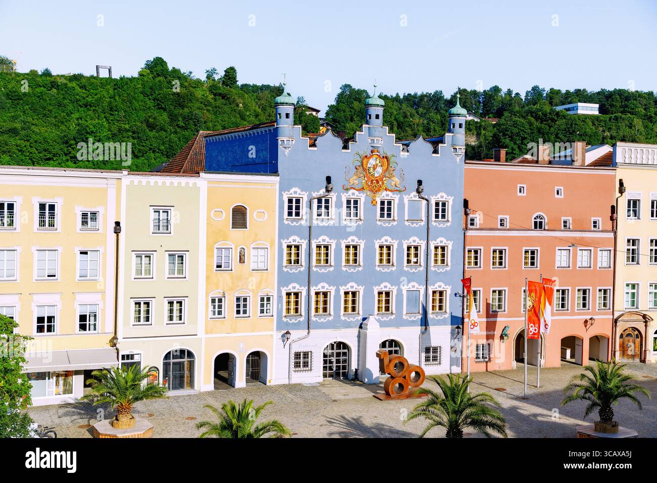 Town square with historic town hall and monument commemorating the ...