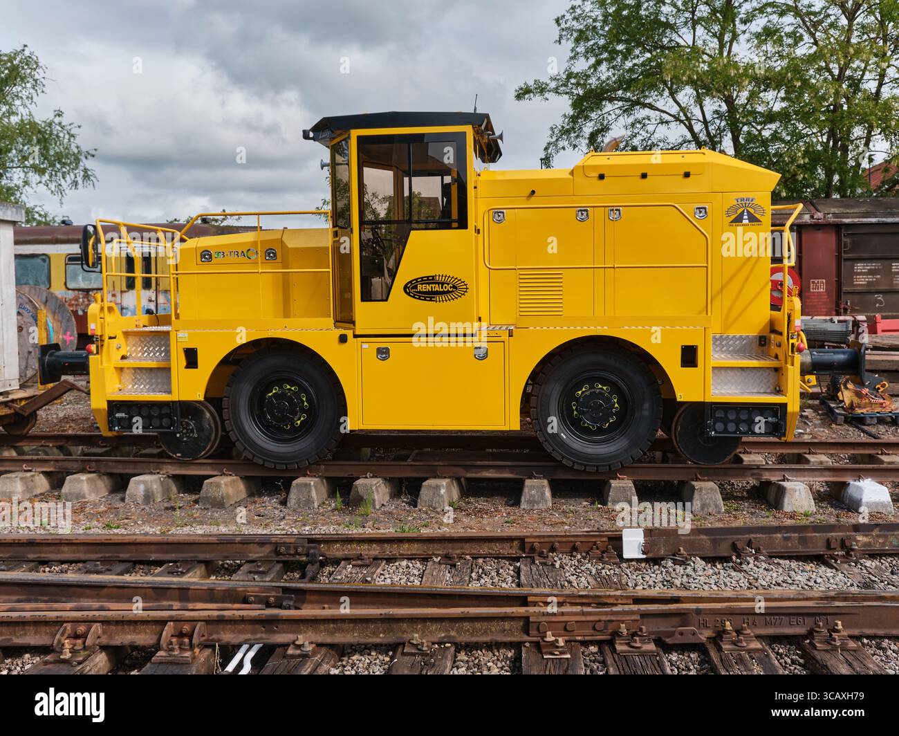 4 May, 2025 - Maldegem, Belgium: Modern yellow road-rail shunting ...