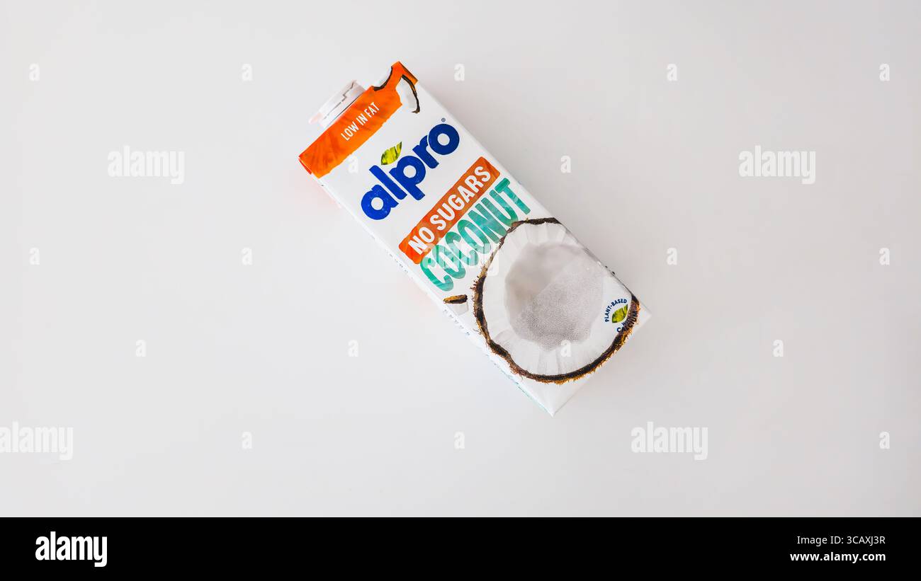 A carton of Alpro No Sugars Coconut drink is displayed on a white ...
