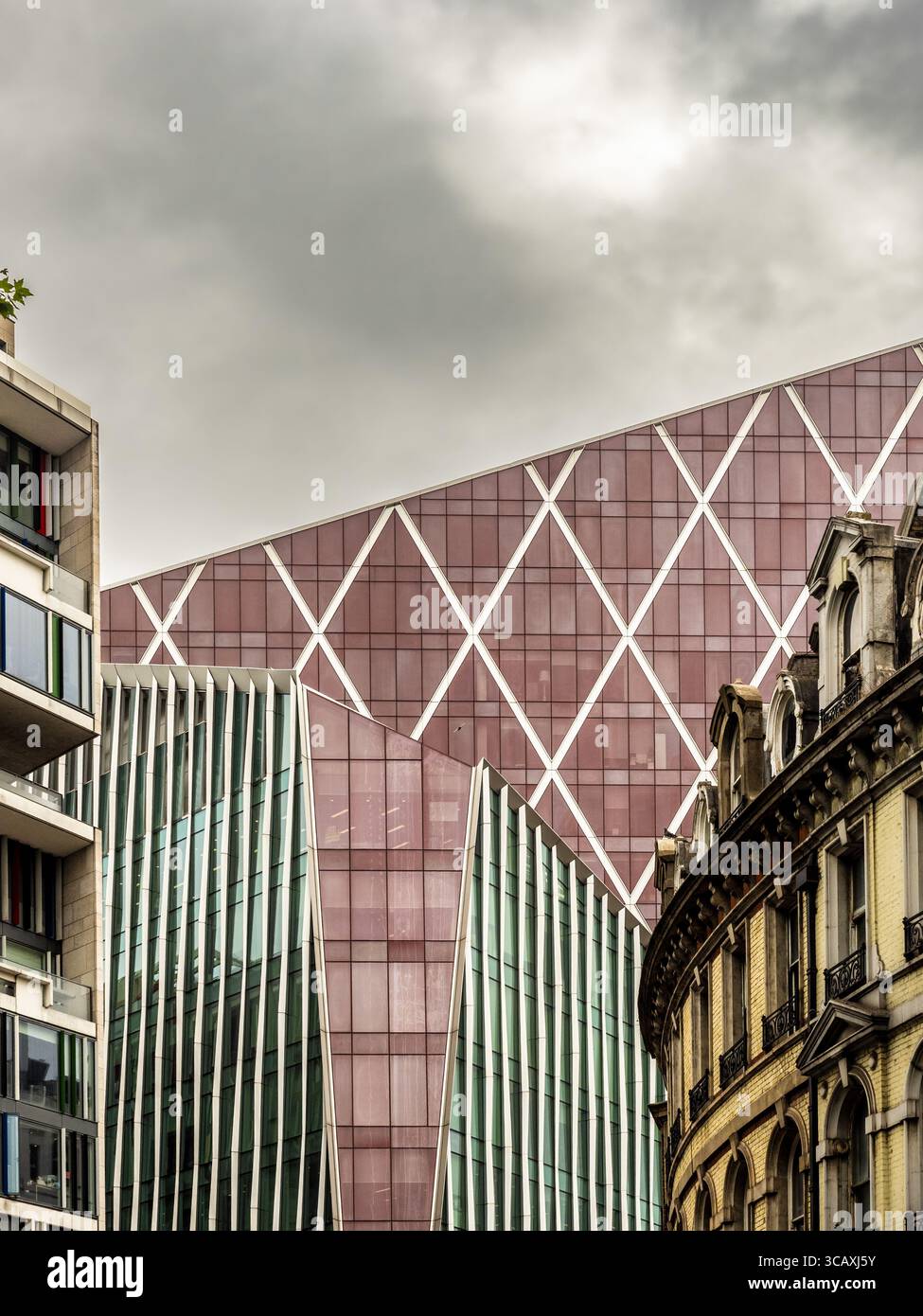 A striking architectural contrast between old Victorian buildings and ...