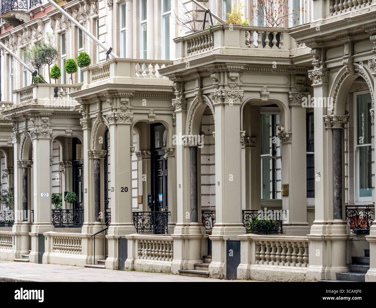 The ornate, columned porches of a grand Victorian residential terrace ...