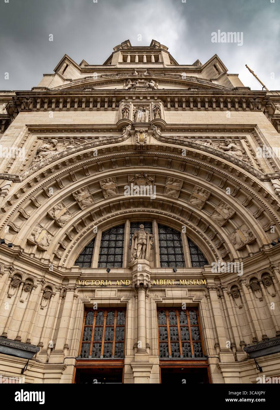 A dramatic low-angle view of the ornate main entrance arch of the ...