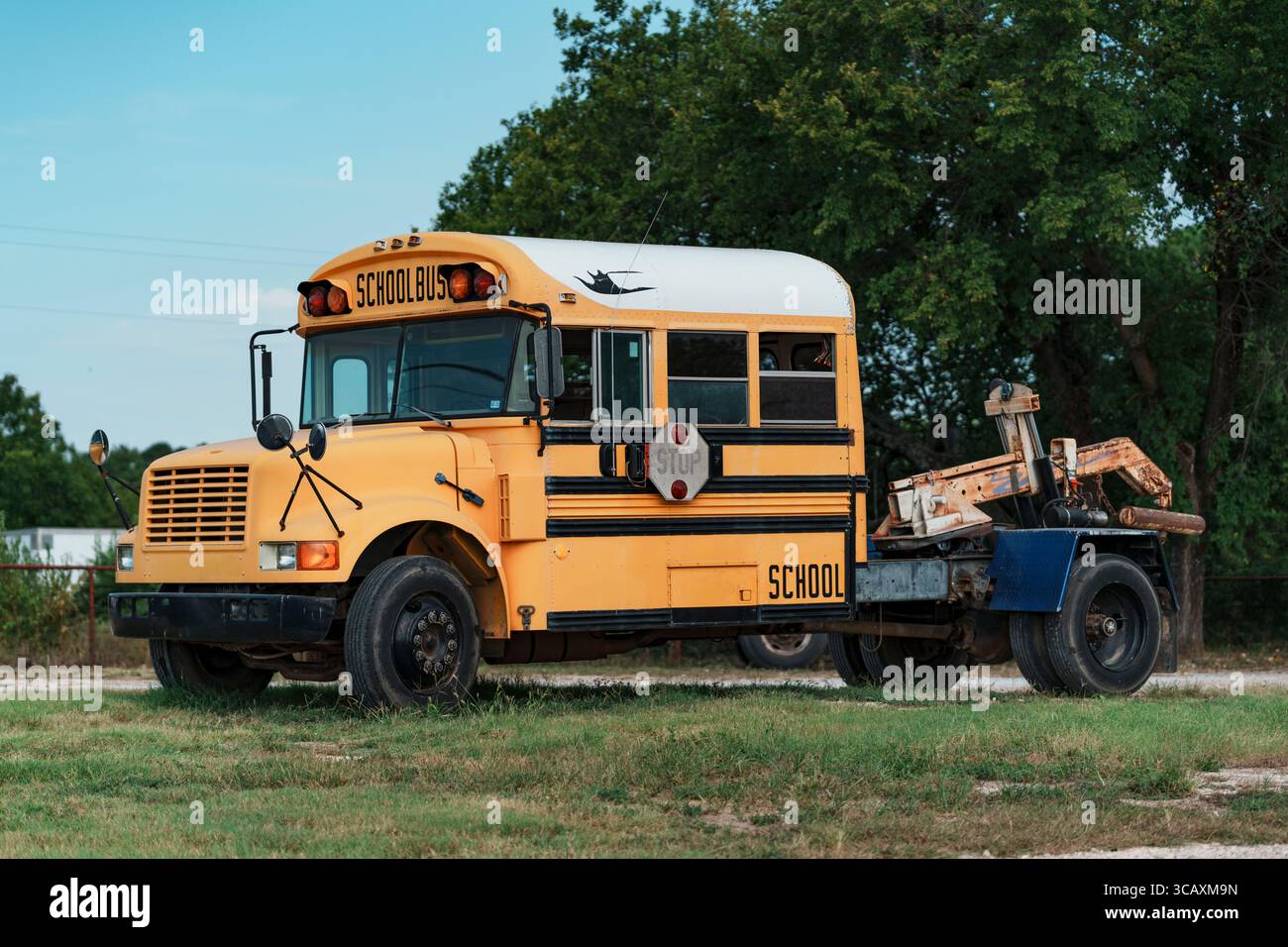 Yellow school bus modified to be a tow truck in a small town in Texas ...