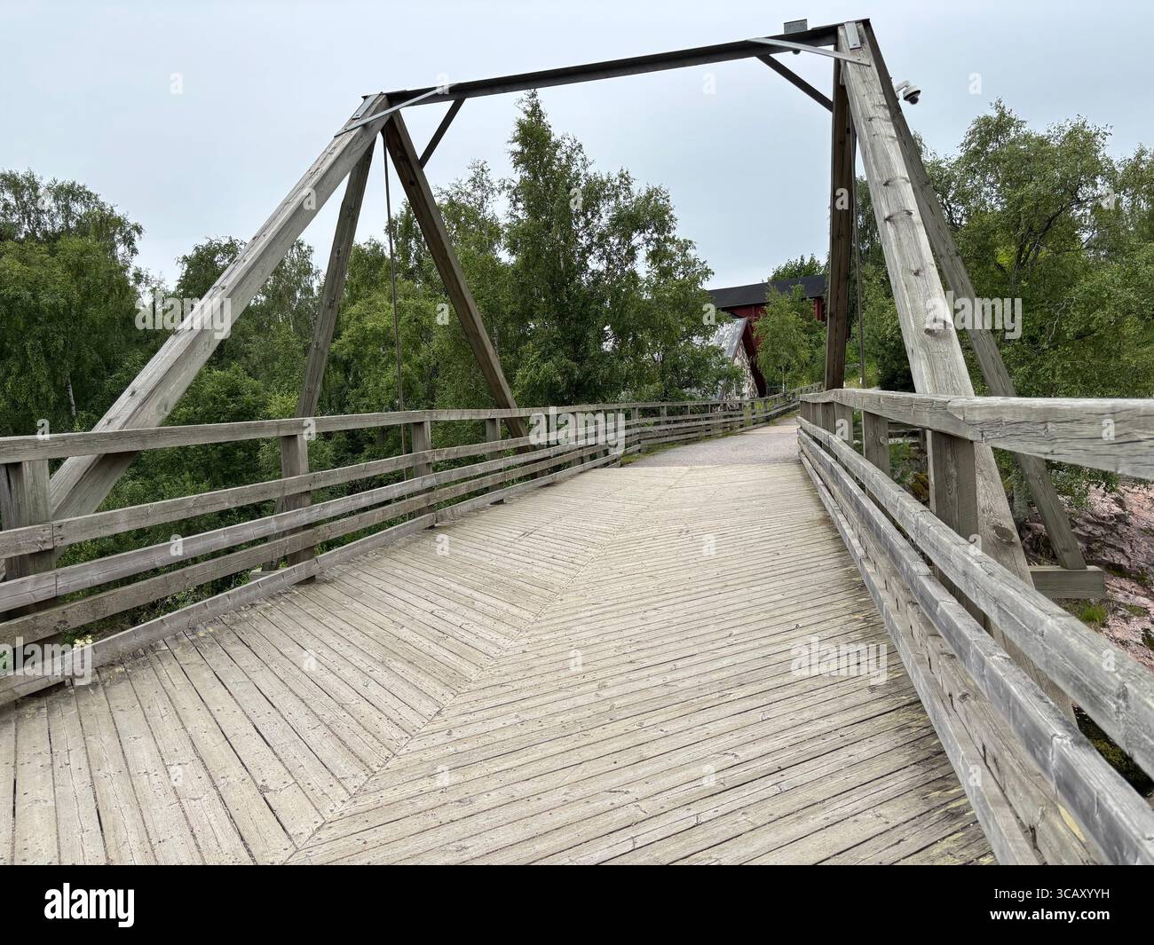 A wooden bridge over Nautelankoski rapids in Turku, Finland Stock Photo ...