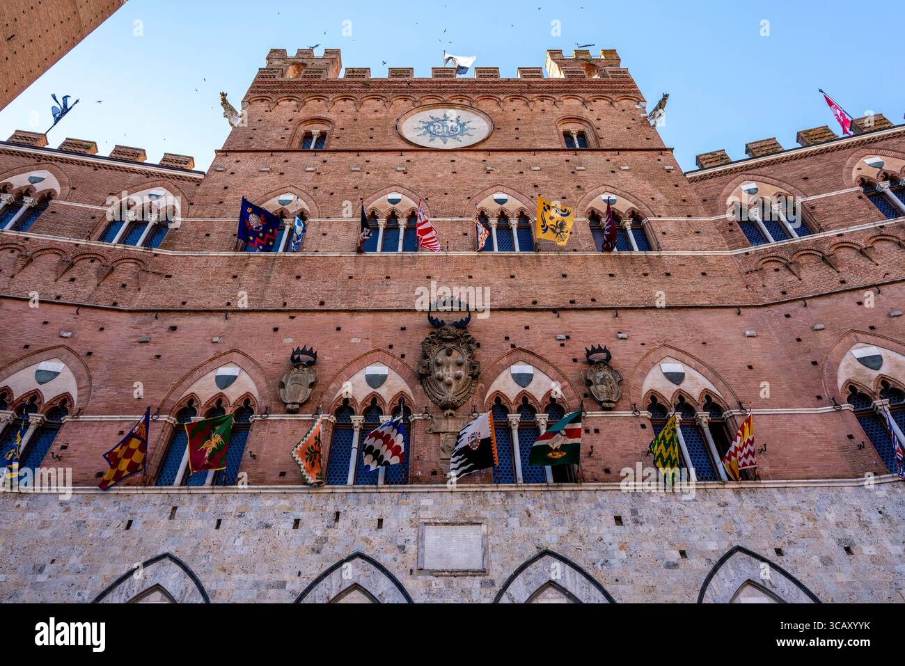Contrada Flags Hang From The Palazzo Pubblico During The Palio, Siena ...
