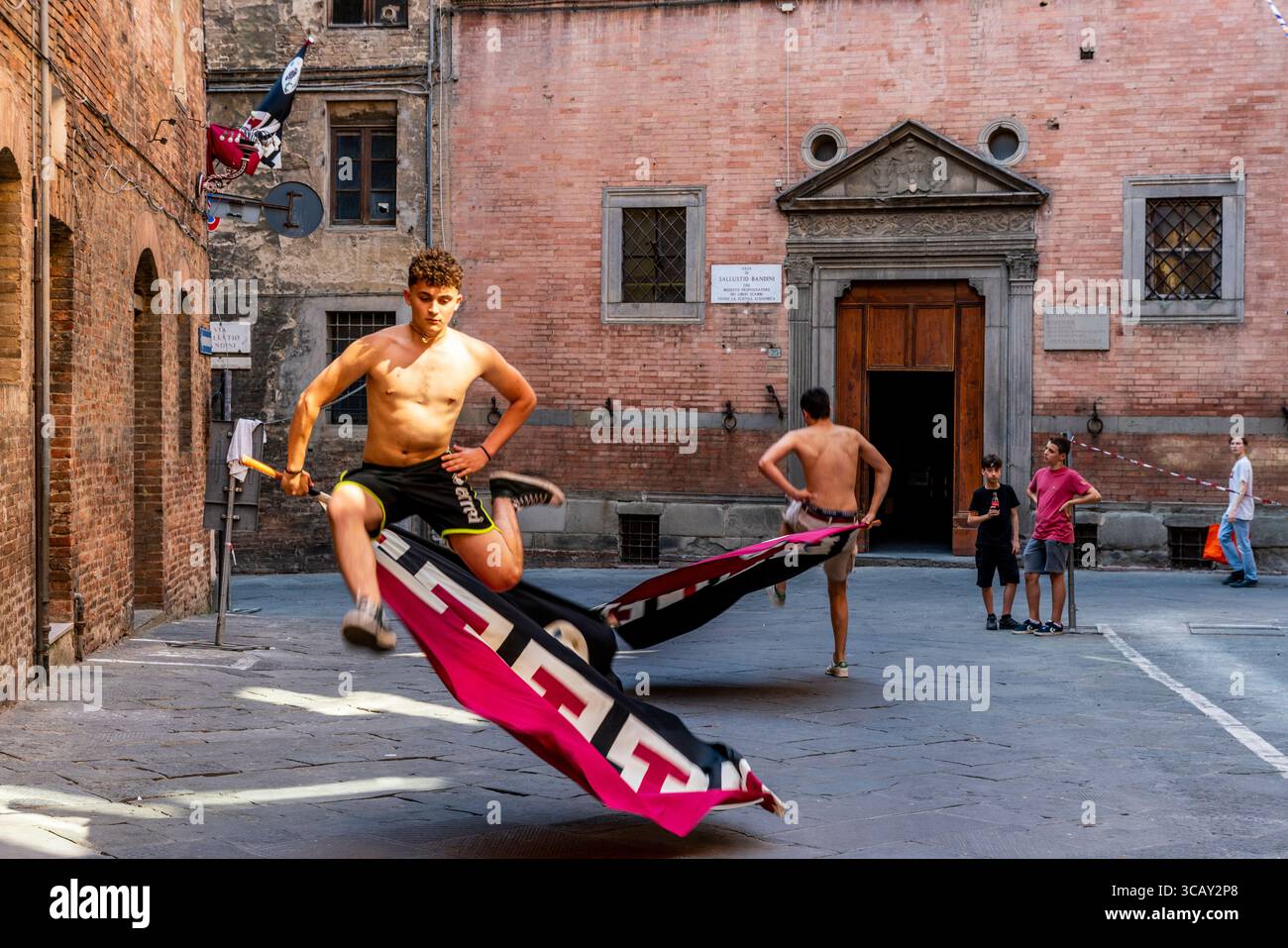 Young Men From The Civetta Contrada Practise Flag Waving/Throwing ...