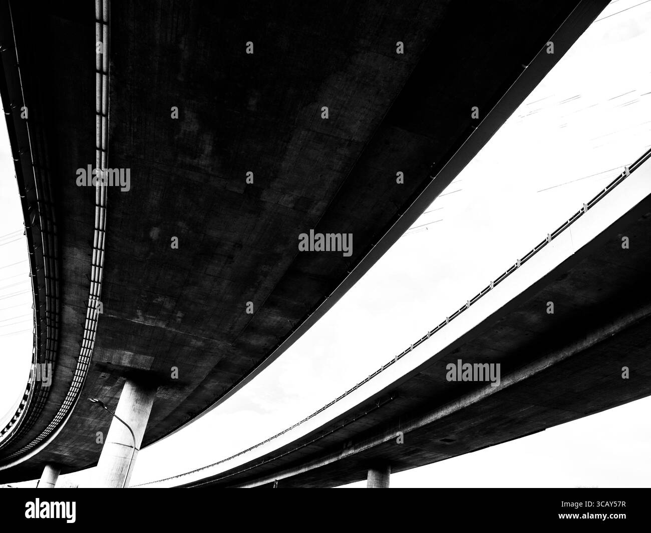 Abstract black and white photo of modern elevated highway bridges with ...
