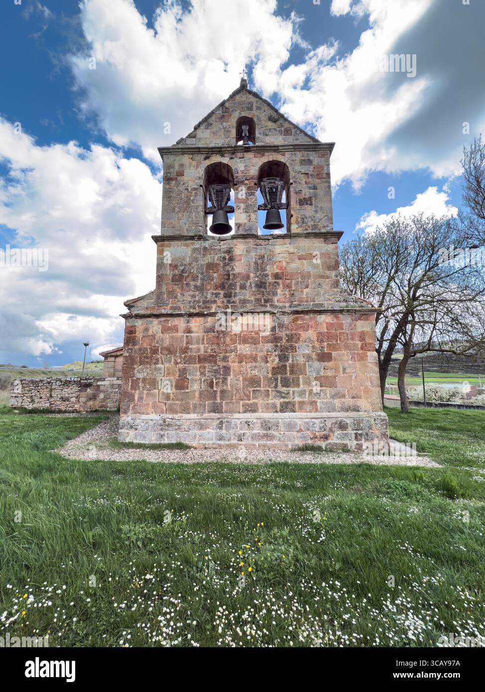 Historic stone bell gable with two bells on an ancient Spanish church ...