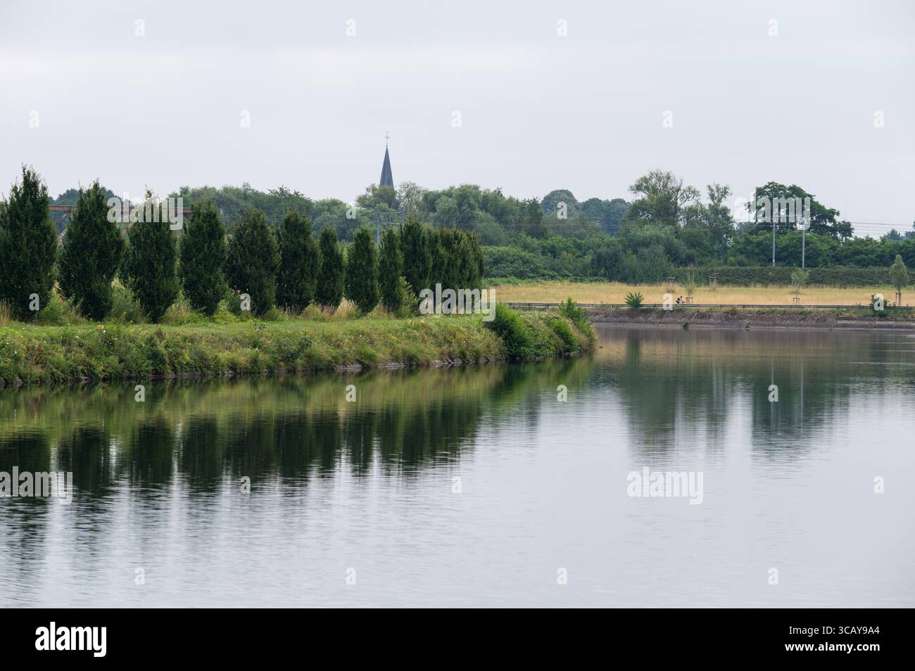 Natural and industrial reflections at the Grand Large water pond in ...
