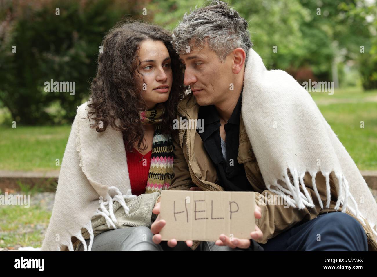Desperate homeless asking charity in hi-res stock photography and ...
