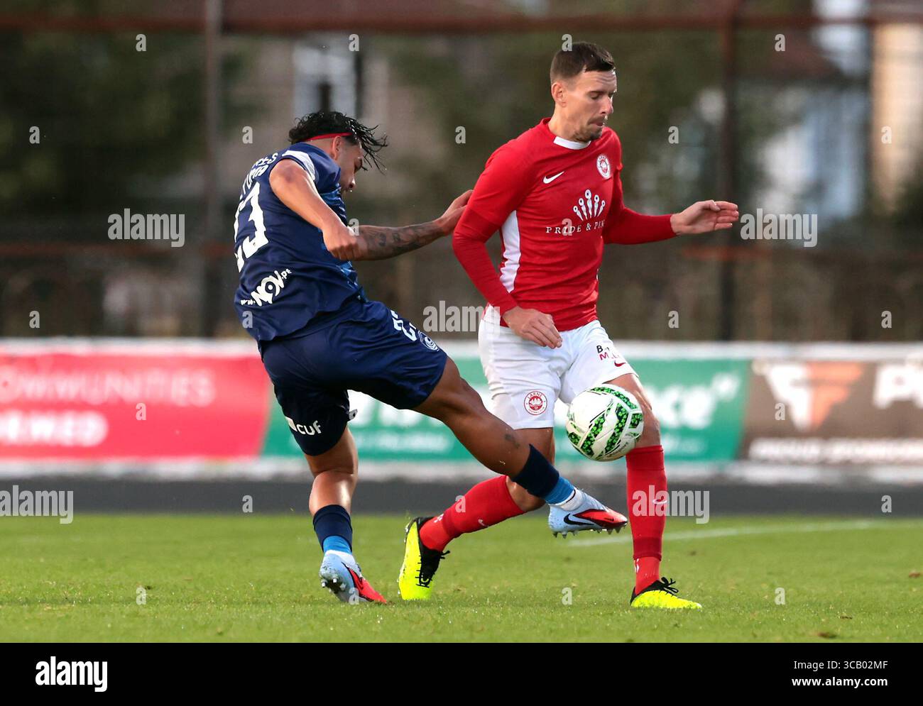 Santa Clara's Sidney Lima (left) and Larne's Mark Randall battle for ...