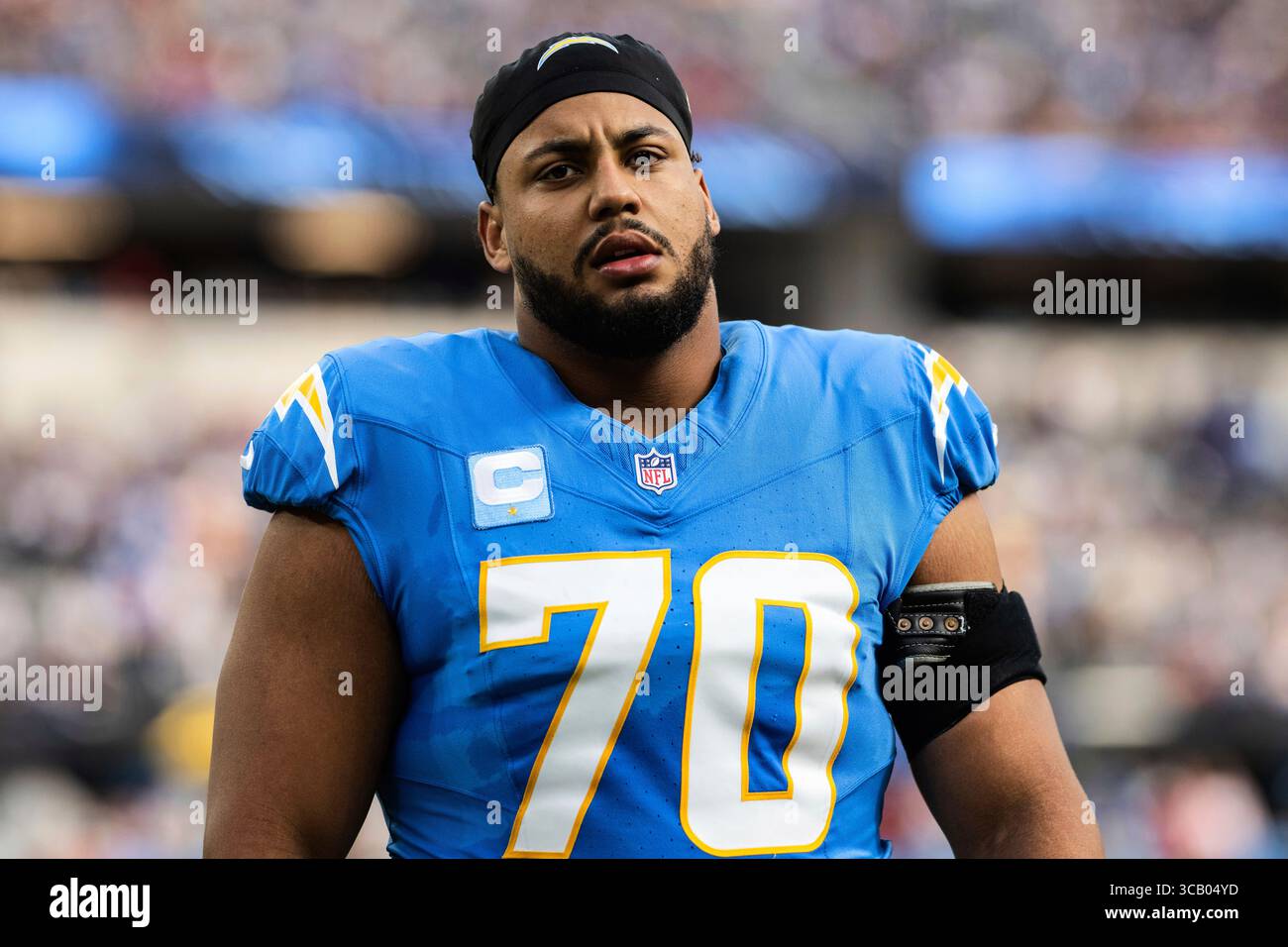FILE - Los Angeles Chargers offensive tackle Rashawn Slater (70) walks ...