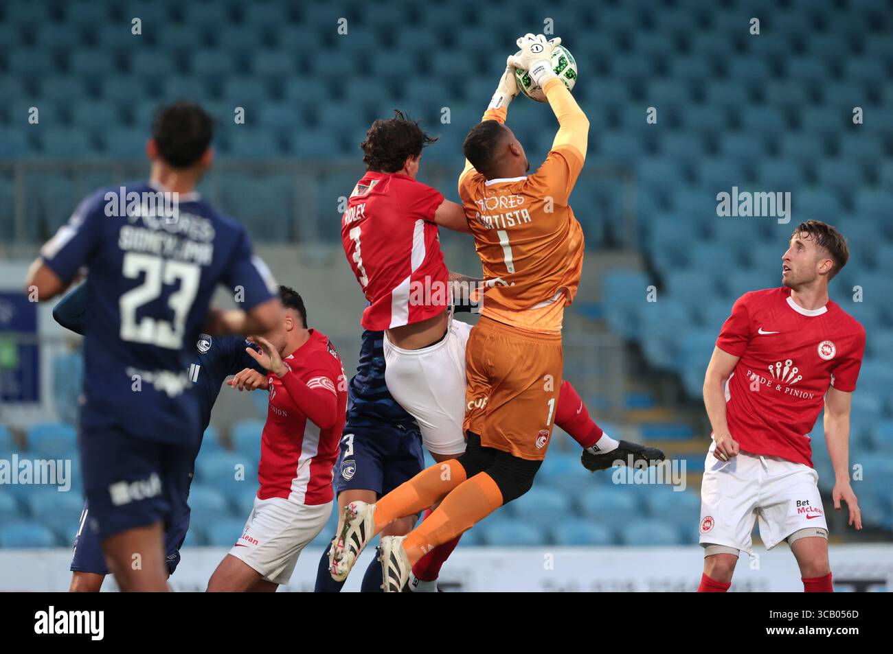 Santa Clara goalkeeper Gabriel Batista claims the ball from Larne's ...