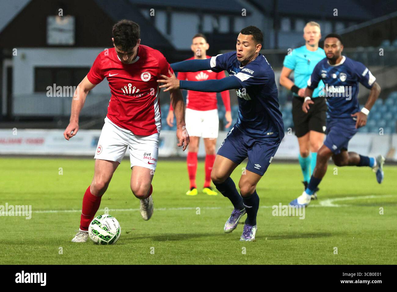 Larne's Tiarnan O'Connor (left) and Santa Clara's Matheus Pereira ...