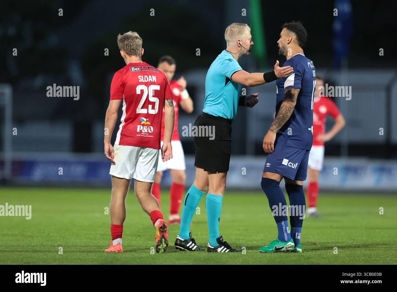 Referee Adam Ladeback (centre) speaks to Santa Clara's Rocha (right ...