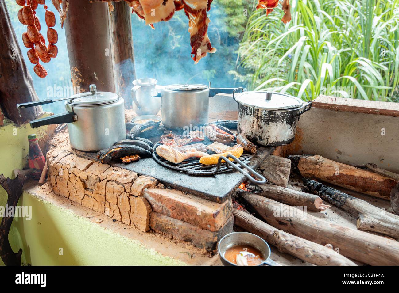 Rustic wood-fired stove in a traditional outdoor kitchen from Santander ...