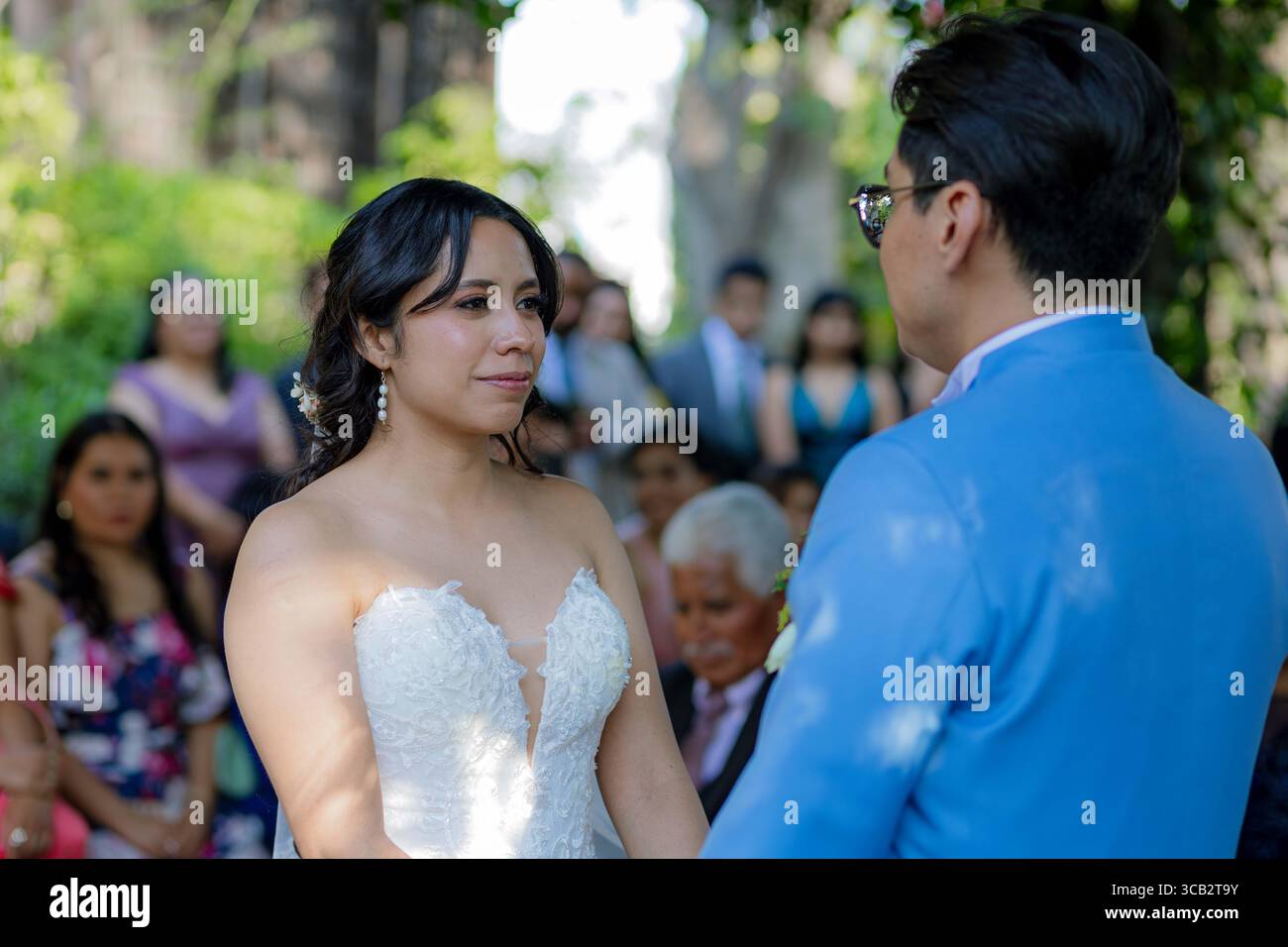 n a lush garden, the couple exchanges solemn and emotional glances ...