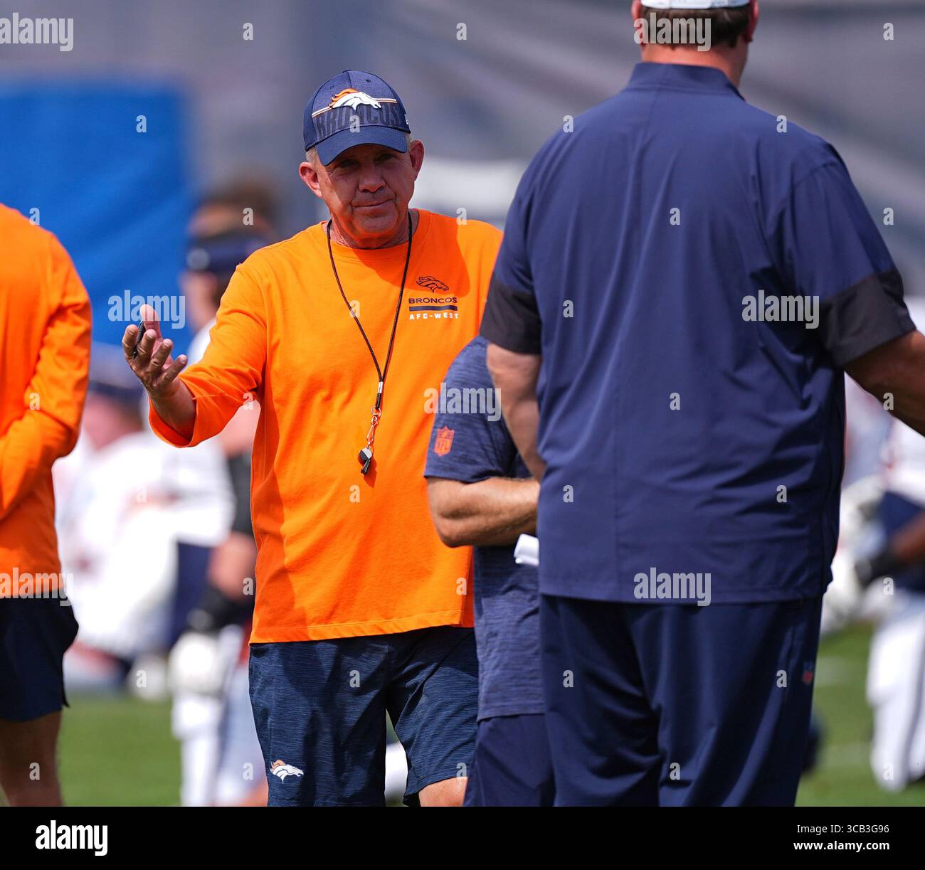 Denver Broncos head coach Sean Payton, center, confers with coaches as ...