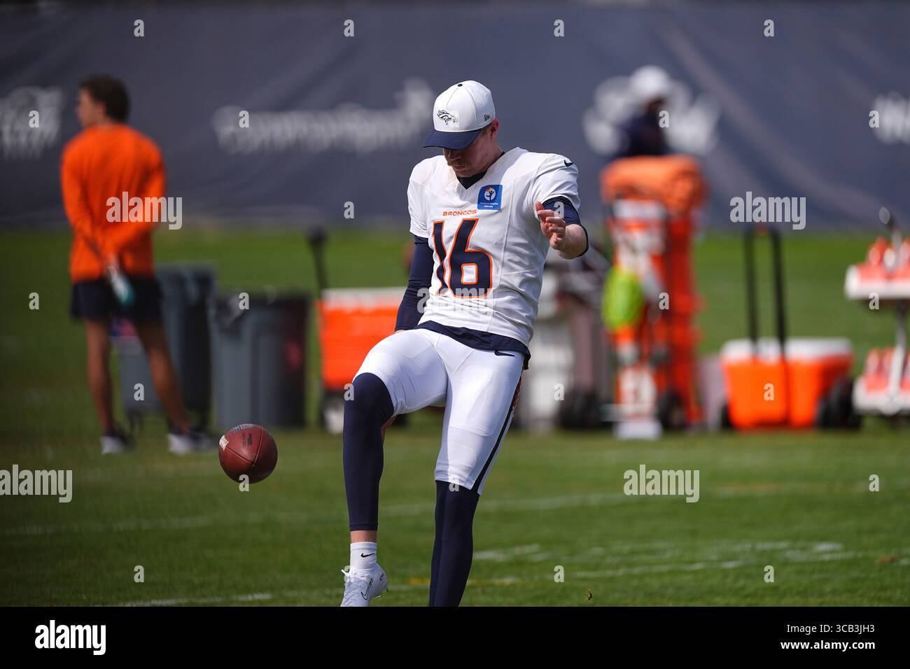 Denver Broncos punter Jeremy Crawshaw (16) warms up during an NFL ...