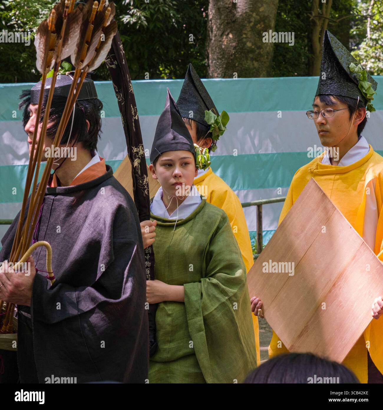 A traditional Japanese procession featuring individuals in cultural ...