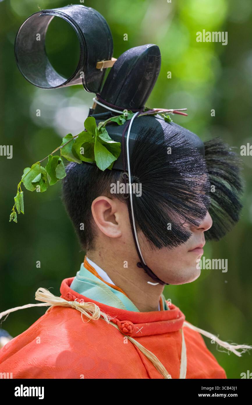Side profile of a person wearing traditional Japanese attire with ...