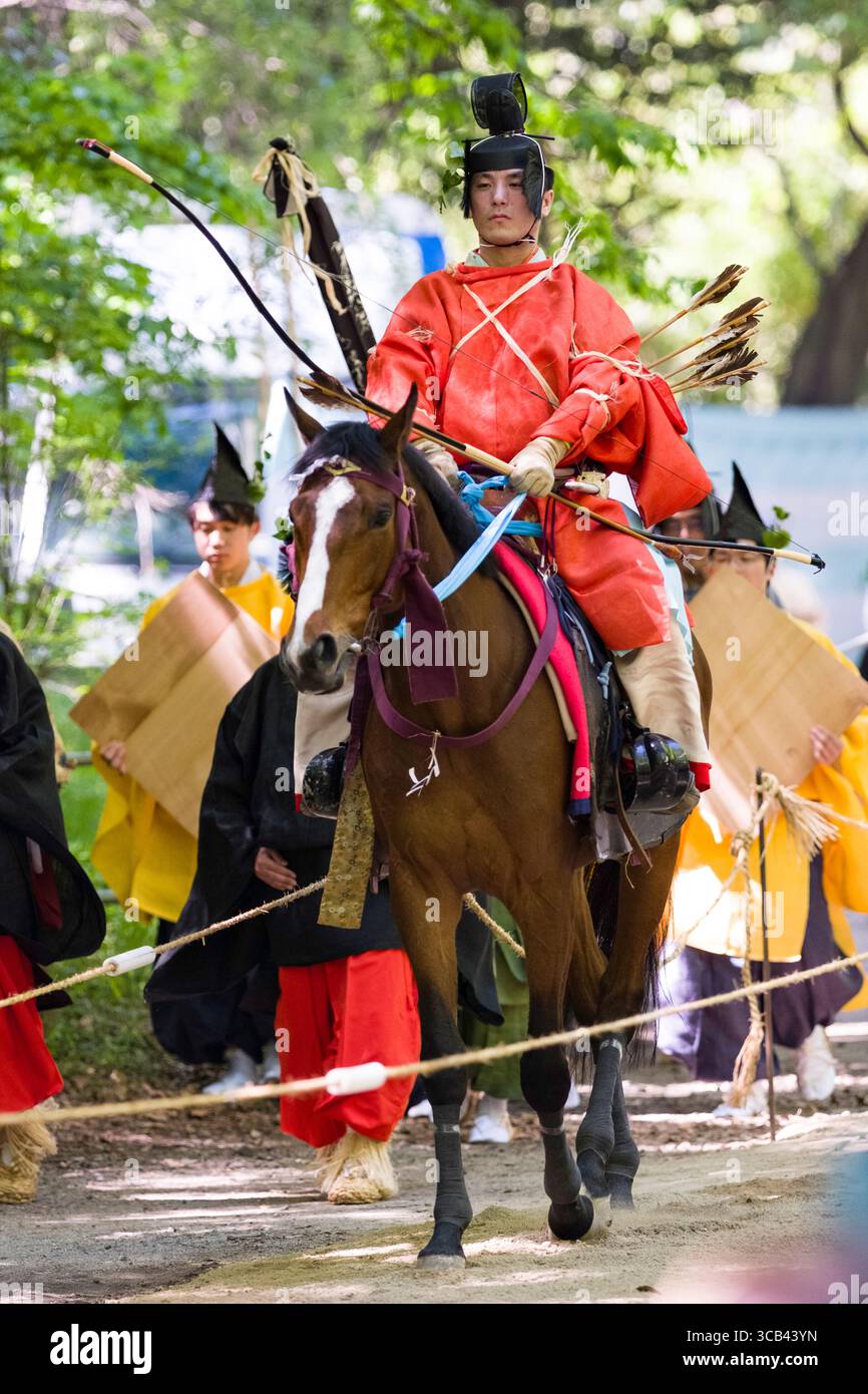 A ceremonial scene depicting a traditional Japanese archer in historic ...