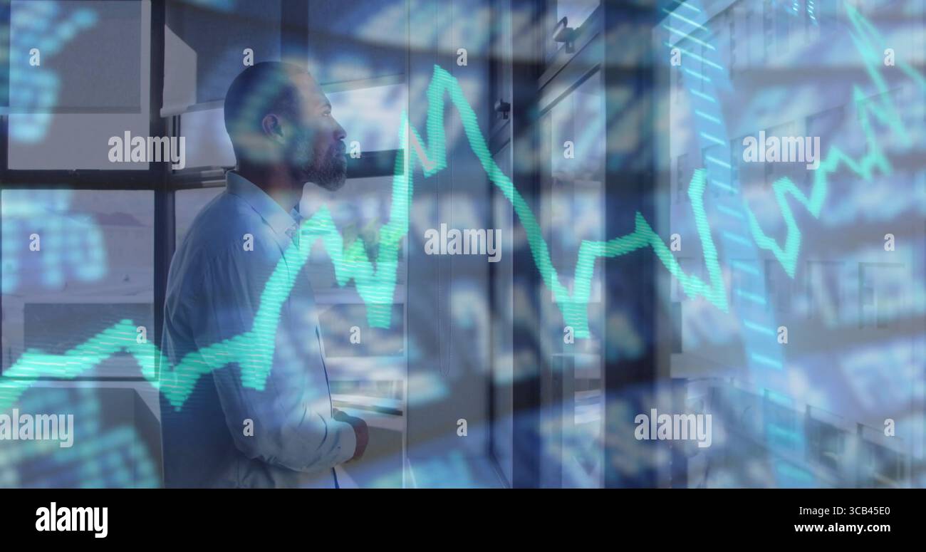 Standing analyst in business attire observing chart overlay on high ...