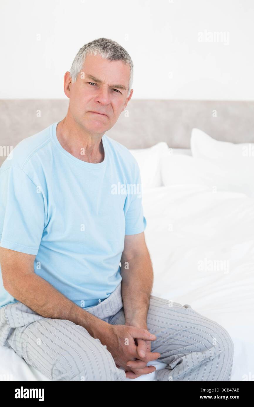 Older man in blue shirt hi-res stock photography and images - Alamy
