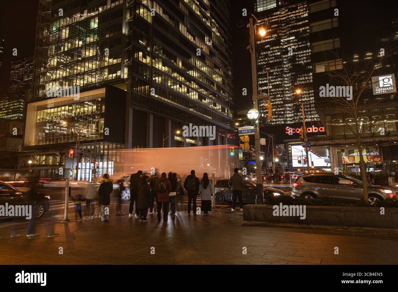 Long exposure photo of a busy Toronto intersection at night, showing ...