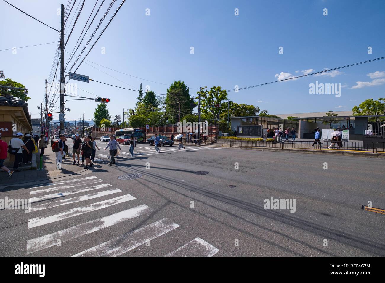 A bustling Shichijo-dori intersection with multiple pedestrians ...