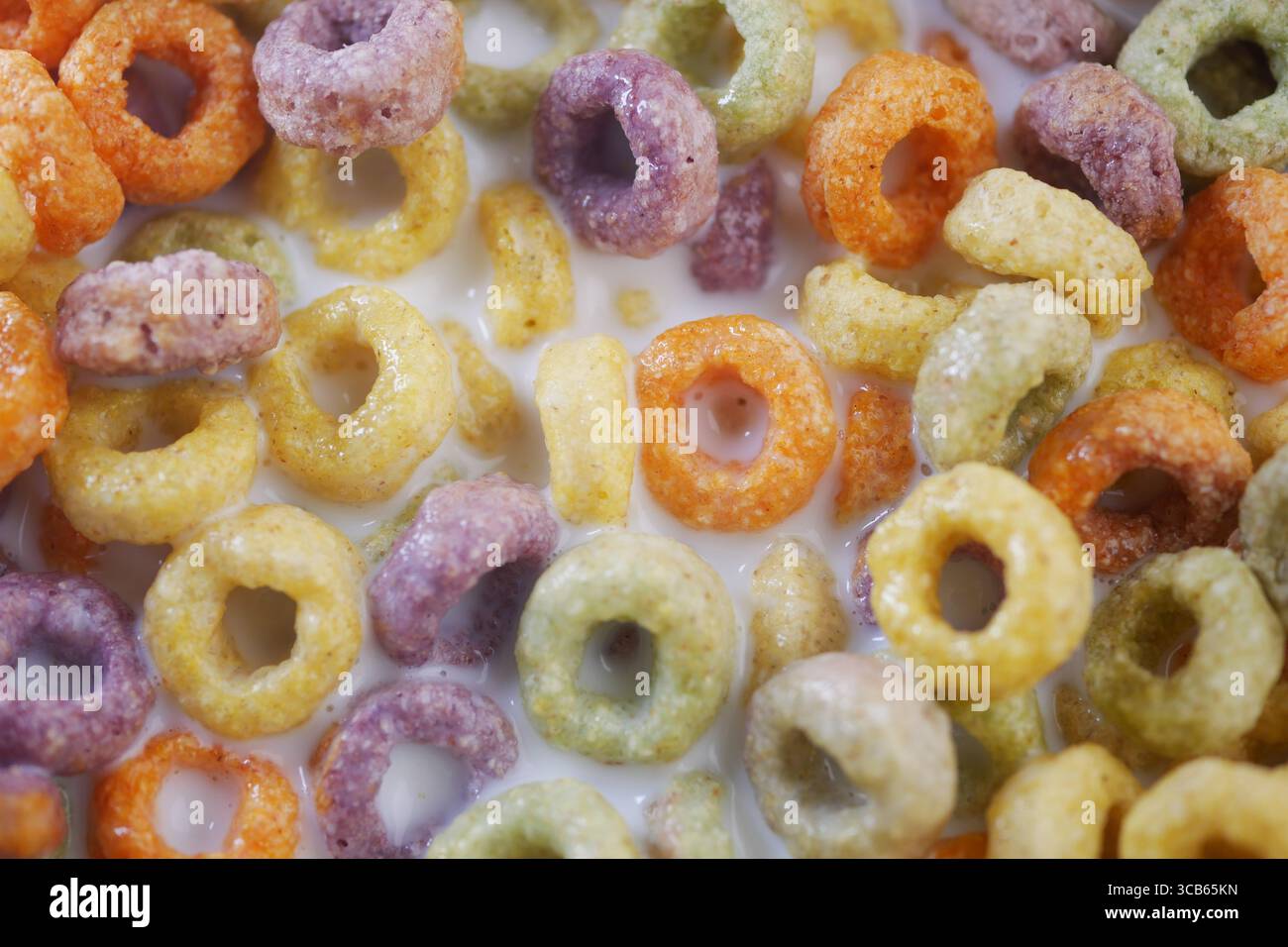 Colorful cereal floating in milk for a breakfast meal Stock Photo - Alamy
