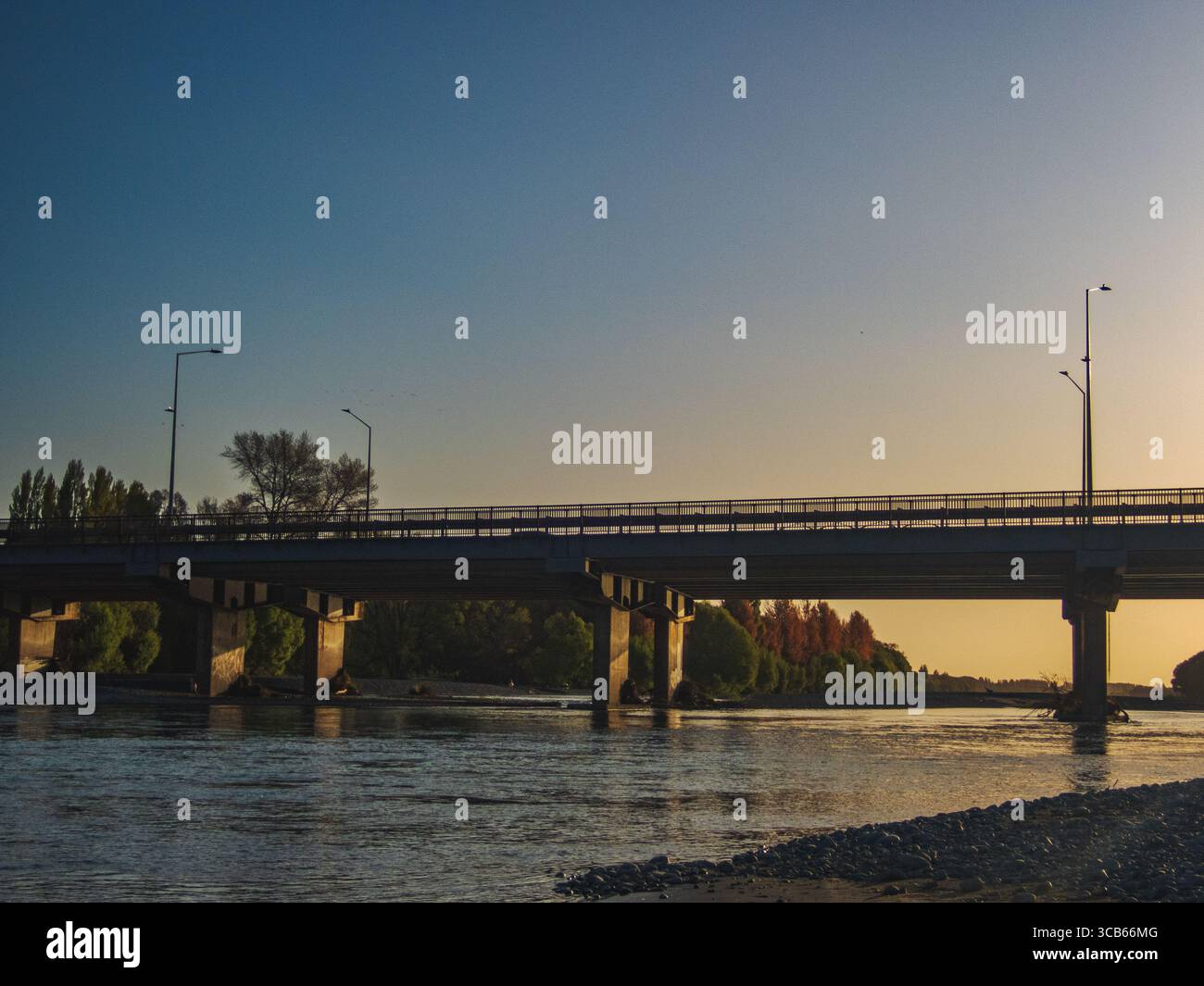 Trees and Bridge near River Stock Photo - Alamy