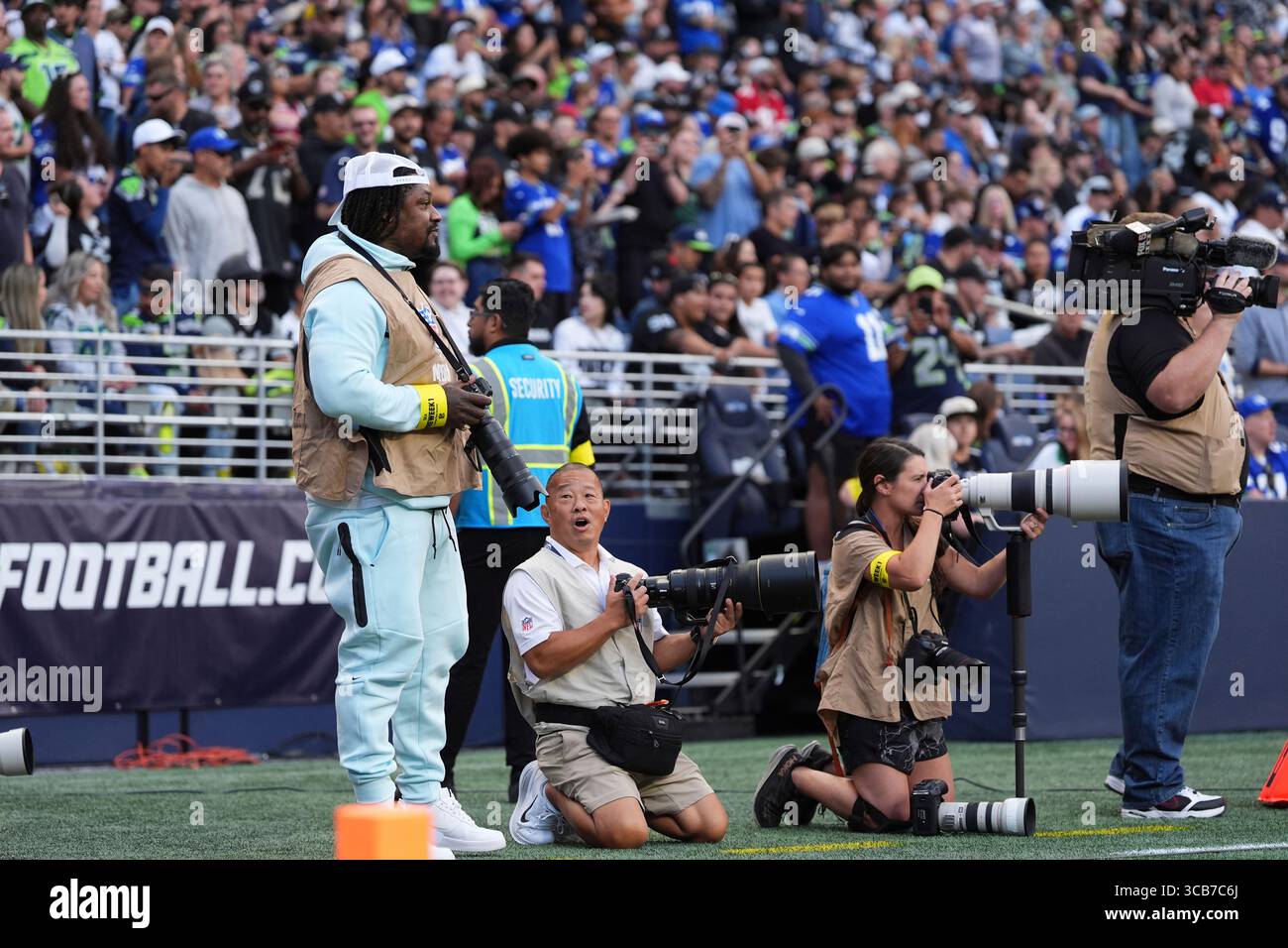 Former NFL player Marshawn Lynch watches an NFL preseason football game ...