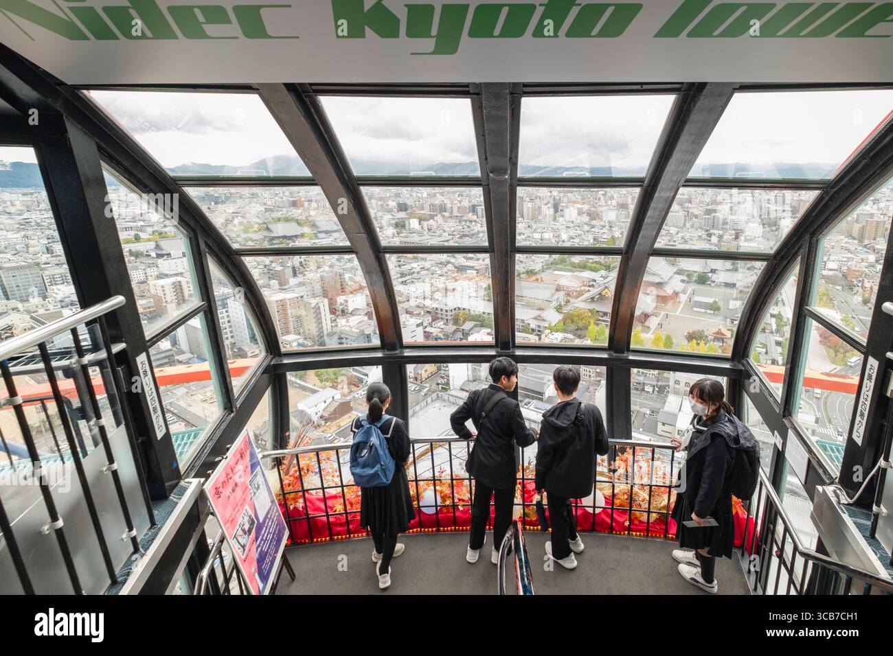 Visitors enjoy a panoramic view of Kyoto cityscape from the Nidec Kyoto ...